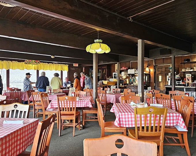 Red and white checkered tablecloths set the stage for serious eating. This isn't dining theater—it's the real deal.