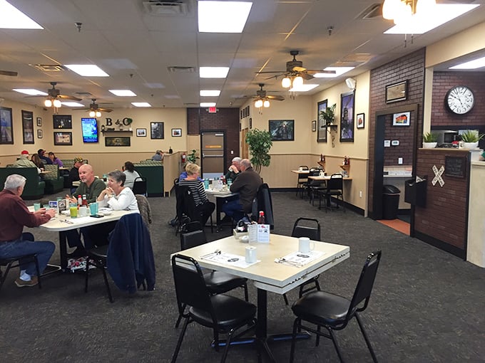 Inside, the warm, inviting dining room buzzes with conversation as ceiling fans lazily spin overhead. This isn't Instagram-bait décor—it's the authentic comfort of a true local gathering spot.