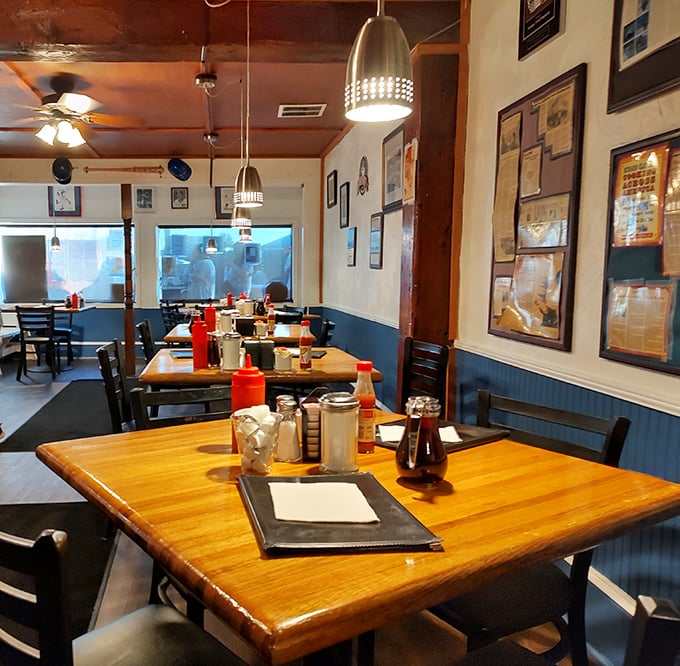 Inside, blue wainscoting meets wooden tables where breakfast dreams come true. This isn't Instagram-bait decor—it's the real deal where food takes center stage. 