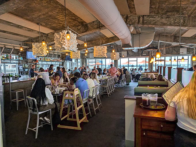 Inside Fleet Landing, diners bask in the glow of unique pendant lights while Charleston Harbor provides the ultimate dinner theater through panoramic windows.