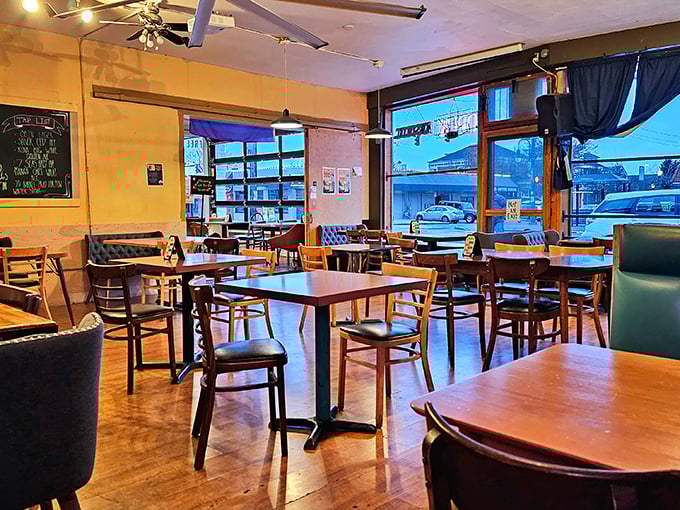 Mismatched chairs, wooden tables, and large windows create that perfect neighborhood vibe—where conversations flow as freely as the coffee.