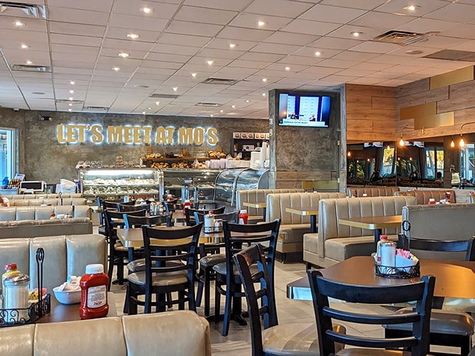 "LET'S MEET AT MO'S" isn't just a neon sign—it's a promise of comfort food paradise. The modern interior blends nostalgic deli vibes with contemporary Florida brightness.