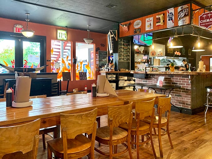 Inside, warm wood tones and brick accents create the perfect backdrop for the serious business of barbecue appreciation.