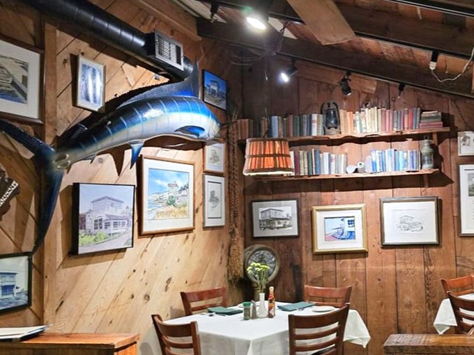 Wooden walls adorned with maritime memorabilia and a mounted marlin create the perfect backdrop for seafood feasting—like dining in the captain's quarters.