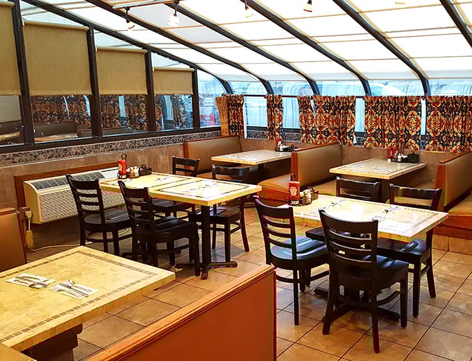 Cozy booths and wooden tables create that perfect "everybody knows your name" atmosphere where memorable meals and conversations naturally unfold.