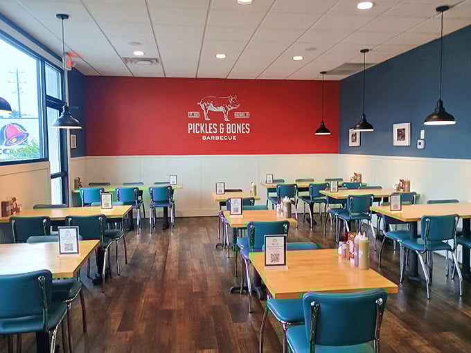 Retro diner meets modern BBQ joint in this clean, inviting space. Those turquoise chairs aren't just stylish—they're perfect for the inevitable food coma that follows.