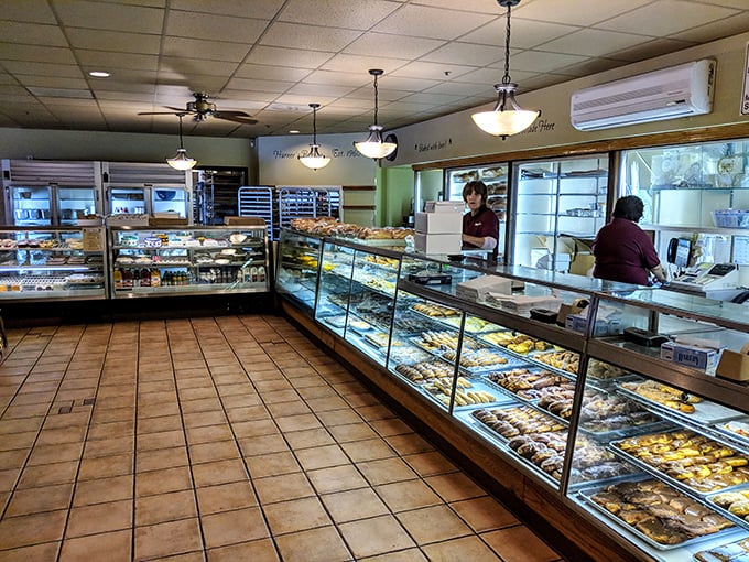 A treasure trove of temptation awaits behind gleaming glass cases, where donuts and pastries line up like contestants in a delicious beauty pageant.