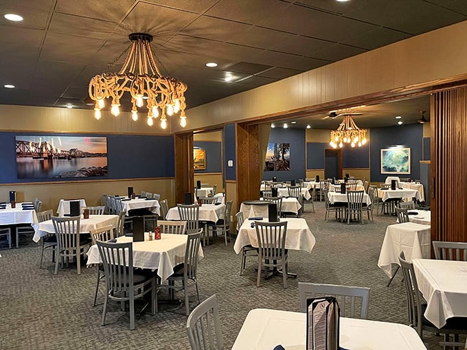 Classic supper club elegance awaits inside, where white tablecloths and warm lighting create the perfect stage for memorable meals.