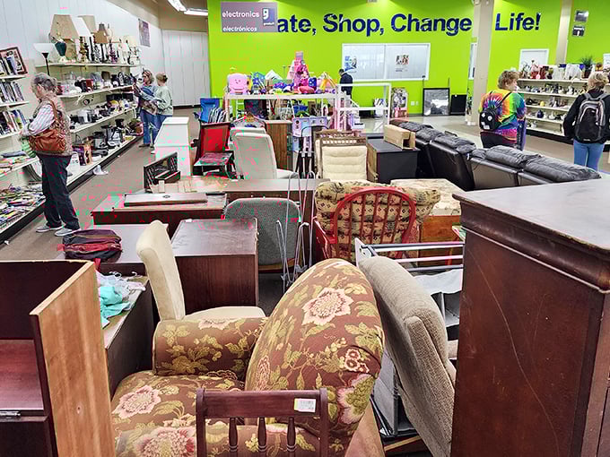 The bright green "Donate, Shop, Change a Life!" wall isn't just catchy—it's literally the store's mission statement.
