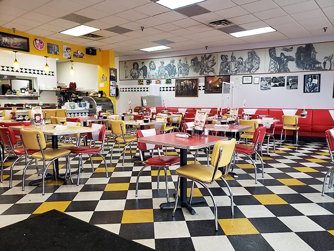 Step inside and suddenly you're in a time machine – checkered floors, cherry-red booths, and yellow walls that practically high-five your eyeballs.