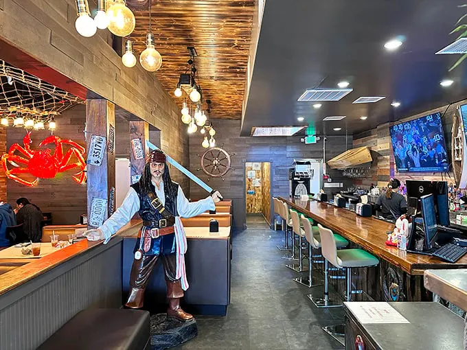 A pirate stands guard over treasures far more valuable than gold doubloons—perfectly seasoned seafood that would make Blackbeard weep with joy.