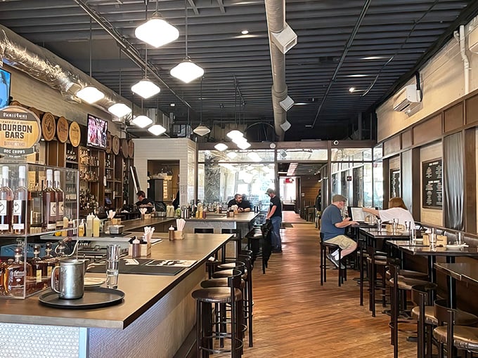 Bourbon barrels line the walls while warm wood tones invite you to pull up a stool. This isn't just a bar—it's Kentucky's liquid history museum.