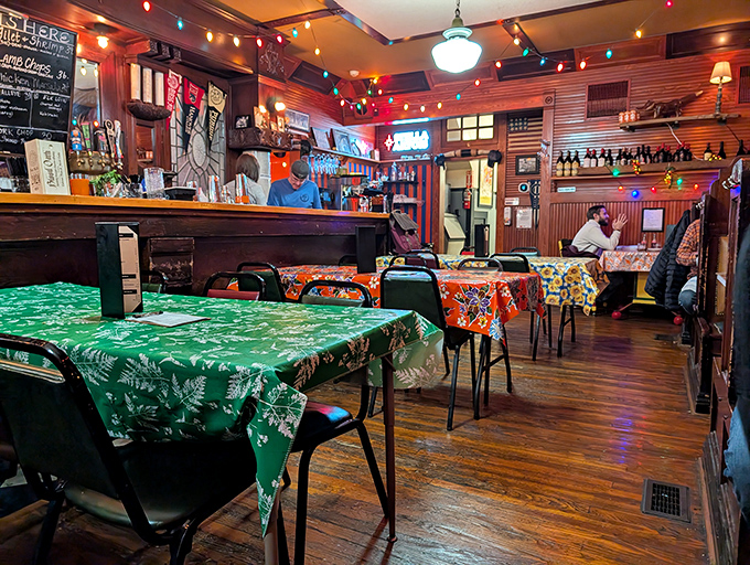 Christmas lights twinkle year-round above mismatched tablecloths, creating the kind of authentic charm that corporate restaurant chains spend millions trying to replicate.