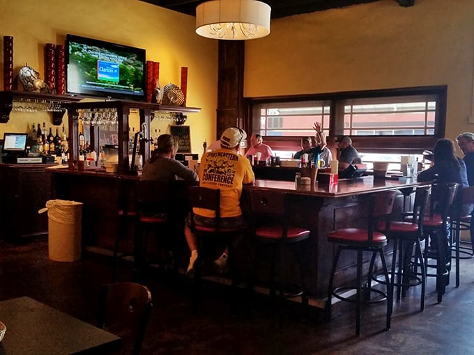The bar at Dupuy's isn't just a place to wait for your table – it's where strangers become friends and cocktails become conversation starters.