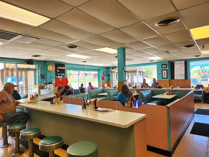 Mint green booths and a counter with swivel stools—this isn't retro by design, it's authentic by survival, a living museum of American dining.