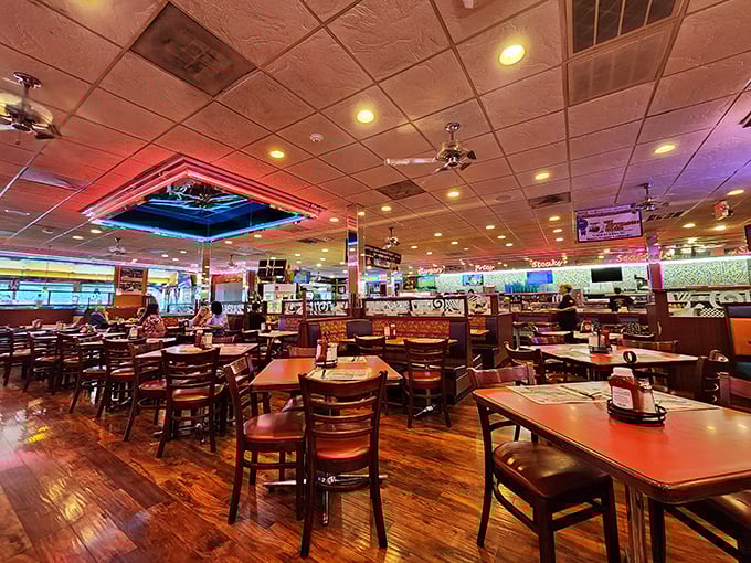 Inside, neon lights cast a warm glow over wooden floors and comfortable booths. This isn't Instagram-manufactured nostalgia—it's the real deal.
