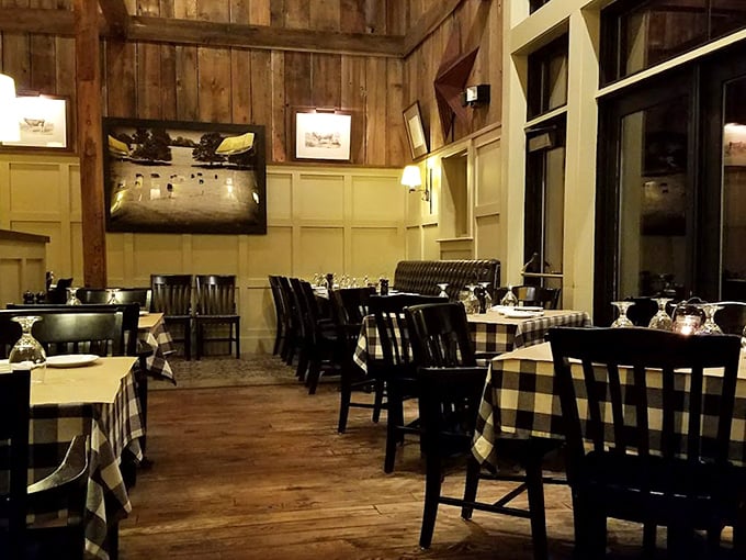 Warm wooden walls and checkered tablecloths create that perfect balance of rustic charm and refined dining—like a countryside hug with white tablecloth service.