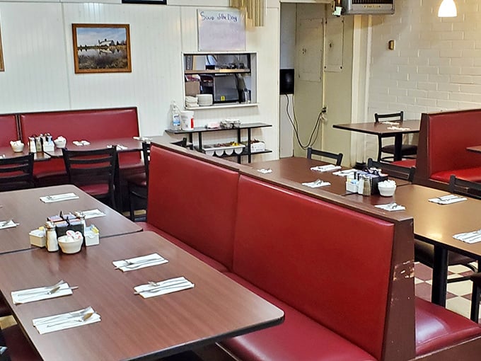 Those cherry-red booths aren't just seating—they're front-row tickets to the greatest show on earth: breakfast done right.