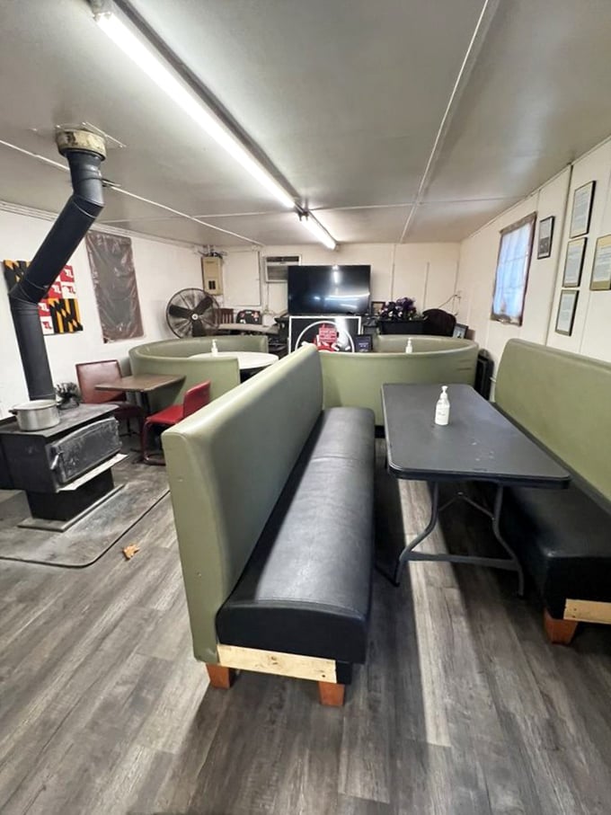 Booth seating that wouldn't win design awards but has witnessed countless BBQ epiphanies. The wood stove in the corner isn't decorative—it's essential to the Jake's experience.