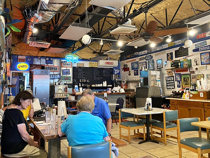 Where fishing license plates meet foodie dreams. The blue walls aren't just decor—they're a canvas for Florida's maritime soul.