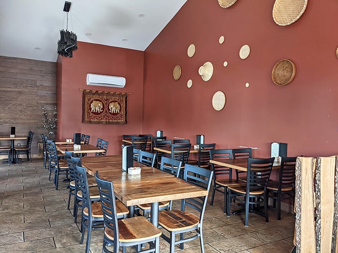 Warm terracotta walls adorned with traditional woven baskets create a dining room that feels like a gentle hug. Comfort first, pretension nowhere to be found.