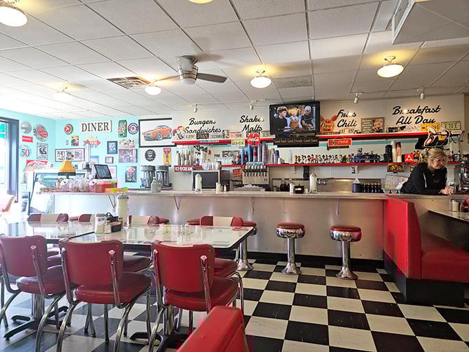 Step inside to a symphony of red vinyl, chrome, and checkerboard floors – the universal language of "good food happens here."