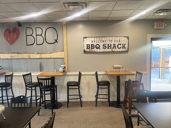Peace, Love, BBQ – the holy trinity of comfort food philosophy adorns walls where memories are made between bites of brisket.