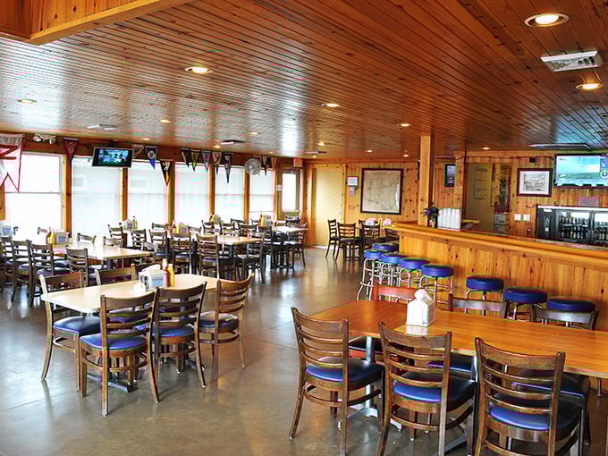 Warm wooden paneling and simple furnishings create that perfect "island time" atmosphere where conversations flow as freely as the drinks.