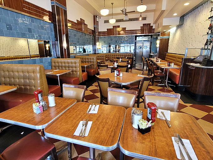 Classic diner perfection awaits inside with leather booths, wood paneling, and that checkered floor that's witnessed countless New York stories unfold.