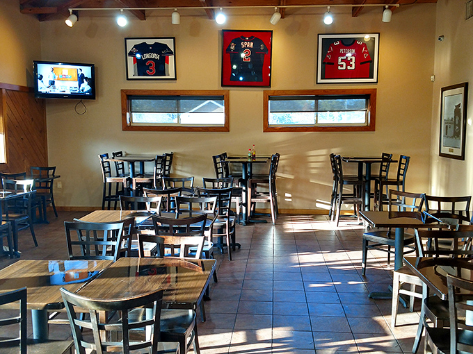 Simple tables, framed jerseys, and the promise of barbecue bliss. No Edison bulbs or reclaimed wood here—just a temple to honest-to-goodness flavor.