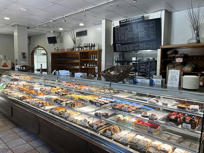 The display case that launched a thousand road trips—each shelf a testament to German baking precision.