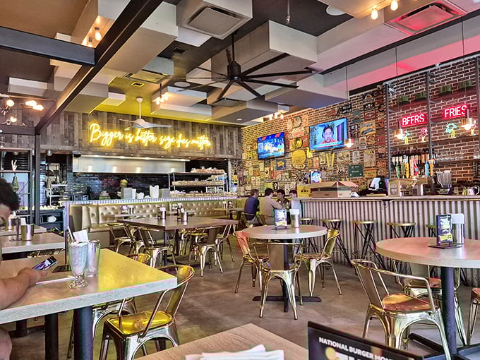 Industrial-chic meets comfort inside, where exposed brick walls and neon signs create the perfect backdrop for your imminent food coma.