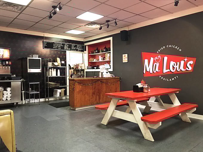 Inside, minimalist charm rules with red picnic tables against dark walls. The sparse decor keeps your focus where it belongs—on that glorious chicken.