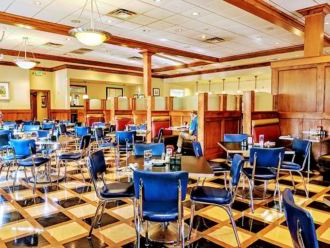 Warm wood tones and classic blue chairs create that perfect "come sit a spell" atmosphere that's increasingly rare in today's dining landscape.