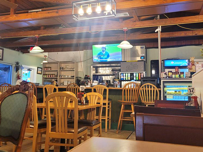 Step inside and you're greeted by wooden chairs, exposed beams, and the kind of authentic diner atmosphere money can't manufacture.