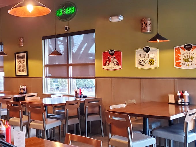 Craft beer signage and warm pendant lighting create that perfect "I could stay here all afternoon" vibe that every great barbecue joint needs.