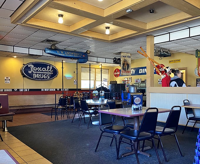 Vintage signs and warm lighting create that perfect "where everybody knows your name" vibe. The Rexall Drugs sign whispers of simpler times.