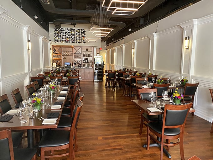 Elegant simplicity defines the interior, where warm wood floors and crisp white walls create the perfect backdrop for the star of the show—the food.