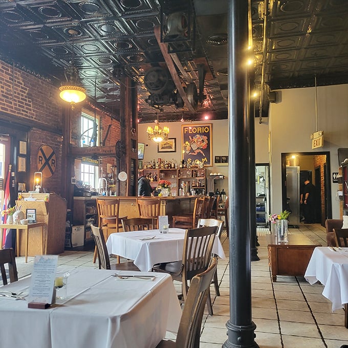 Step inside and time slows down—exposed brick walls, ornate tin ceilings, and warm wooden accents create an atmosphere that's simultaneously upscale and comfortably familiar.