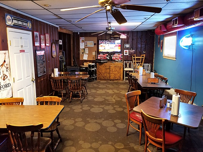 Where mismatched chairs tell stories and ceiling fans keep the secrets. Nu-Way's interior feels like your favorite uncle's basement – if he could cook like a genius.