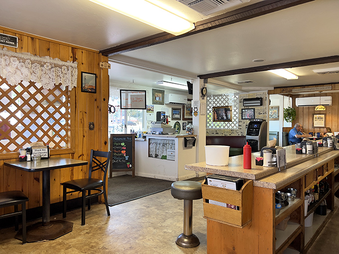 Classic diner DNA at its finest – wood paneling, counter seating, and lattice dividers create that "everybody knows your name" feeling that chain restaurants spend millions trying to replicate.