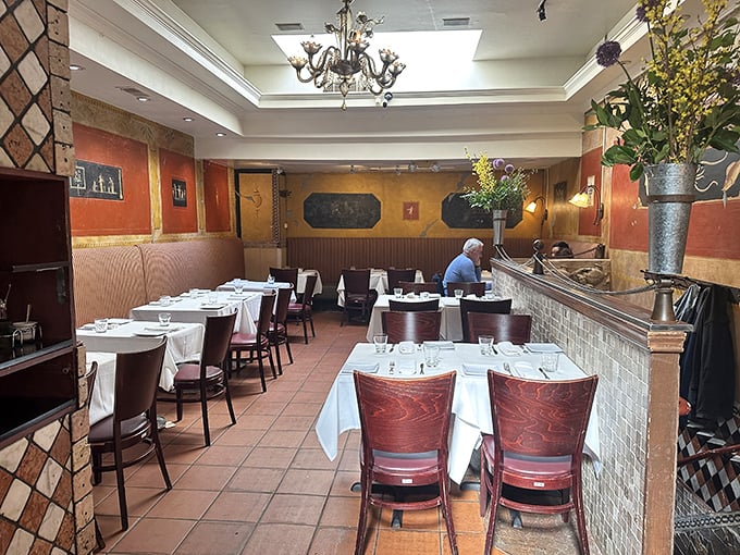 Step inside and the warm terracotta walls embrace you like an Italian grandmother. This isn't just dining—it's time travel without the jetlag.