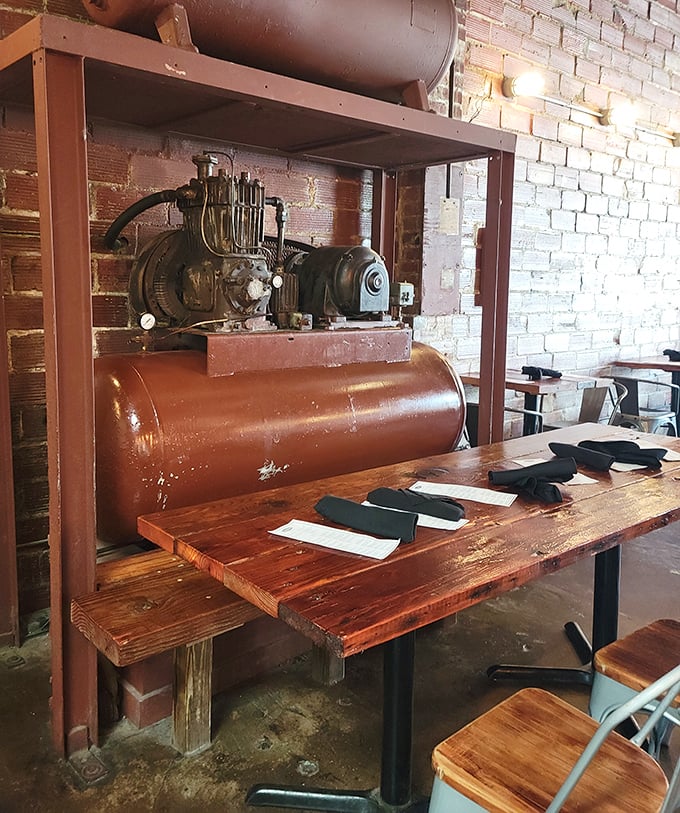 Industrial heritage meets culinary present – this vintage compressor isn't just decoration, it's a conversation starter while you wait for your steak.
