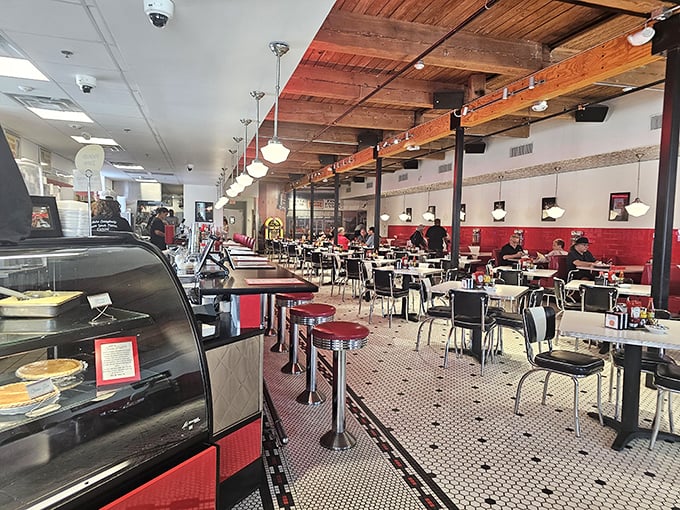 Step inside and you're transported to a simpler time – red vinyl, chrome accents, and wooden ceiling beams create the perfect backdrop for culinary memories in the making.