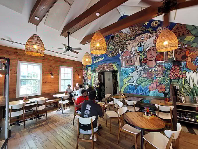 Step inside to discover wooden warmth meets artistic flair—that mural isn't just decoration, it's a conversation starter that'll keep you lingering long after your meal.