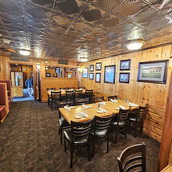Step inside and the knotty pine walls tell stories of countless celebrations, while the pressed tin ceiling reflects decades of dining memories.