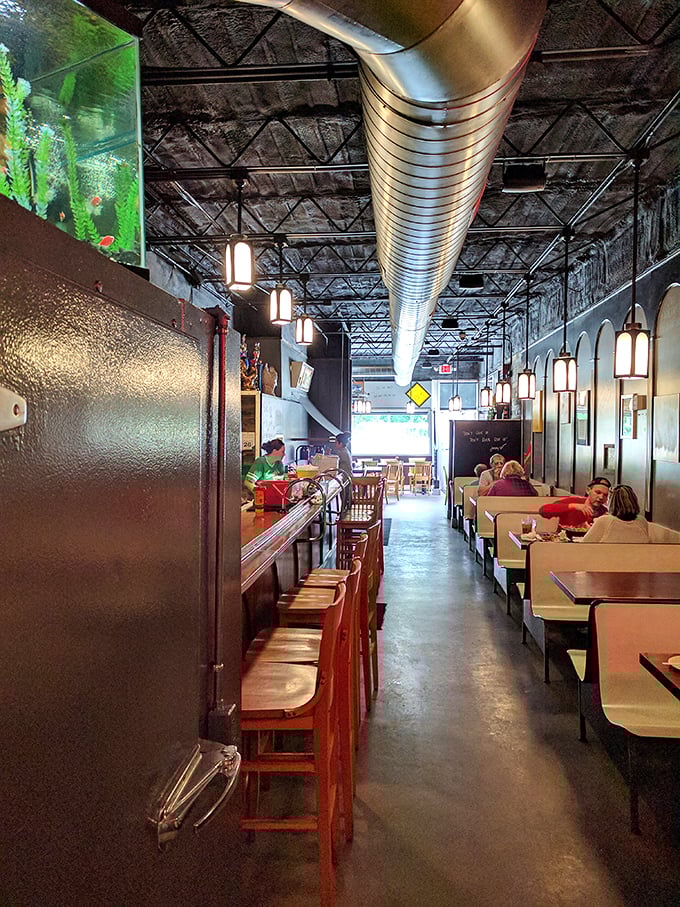 Inside, the narrow dining room with its exposed ceiling and pendant lights creates the perfect backdrop for chicken-induced happiness and neighborly conversation.