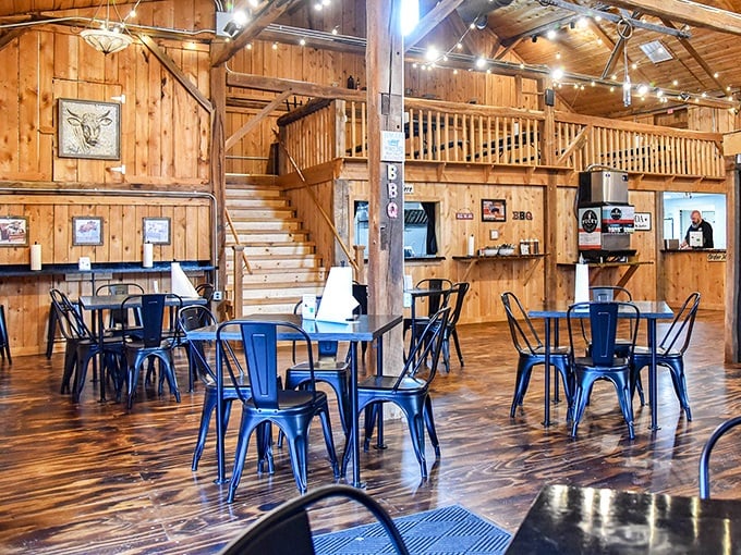 Warm wood paneling and blue metal chairs create that perfect "fancy-casual" vibe where you can lick your fingers without judgment.