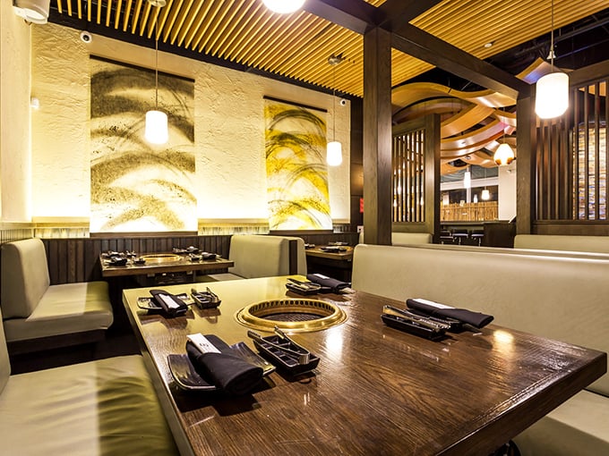 Not just a pretty face—each table transforms into your personal culinary canvas, complete with built-in grill and mood lighting.