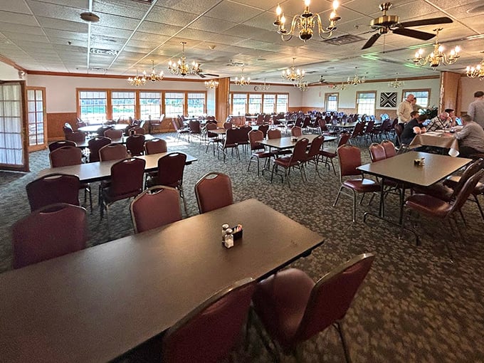 Chandeliers overhead and tables stretching into the distance—this dining room understands that comfort food requires comfortable surroundings.